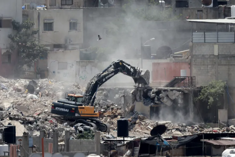 The occupation forces raised their flags on buildings and shops in and ...